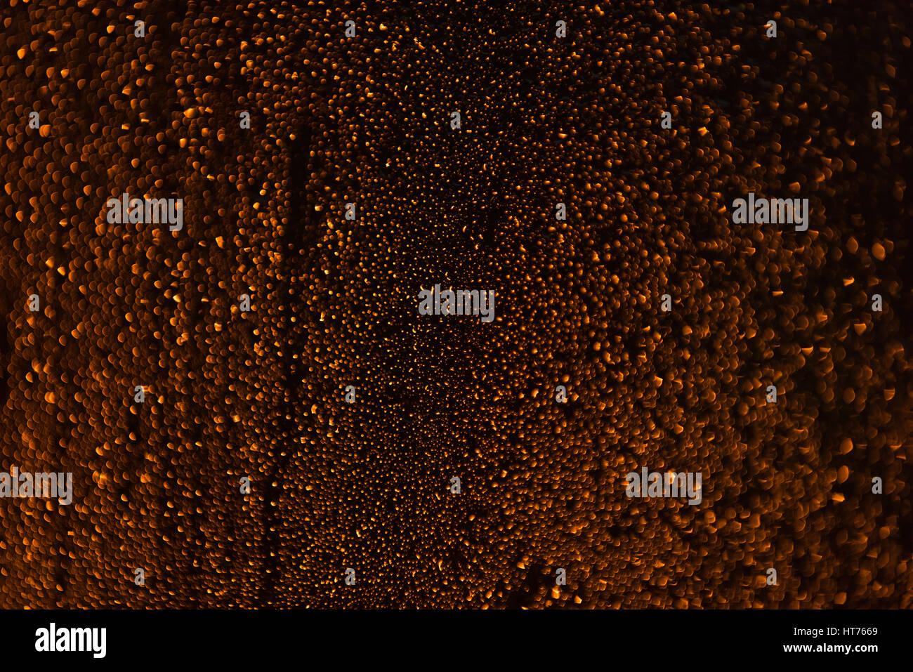 Rain droplets running down a window, abstract backlight background ...