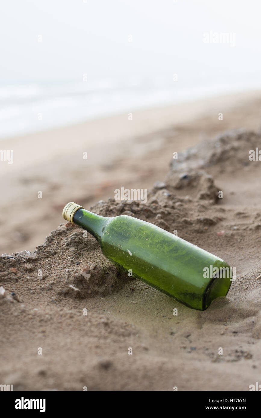 Empty bottle alcohol on beach hi-res stock photography and images - Alamy