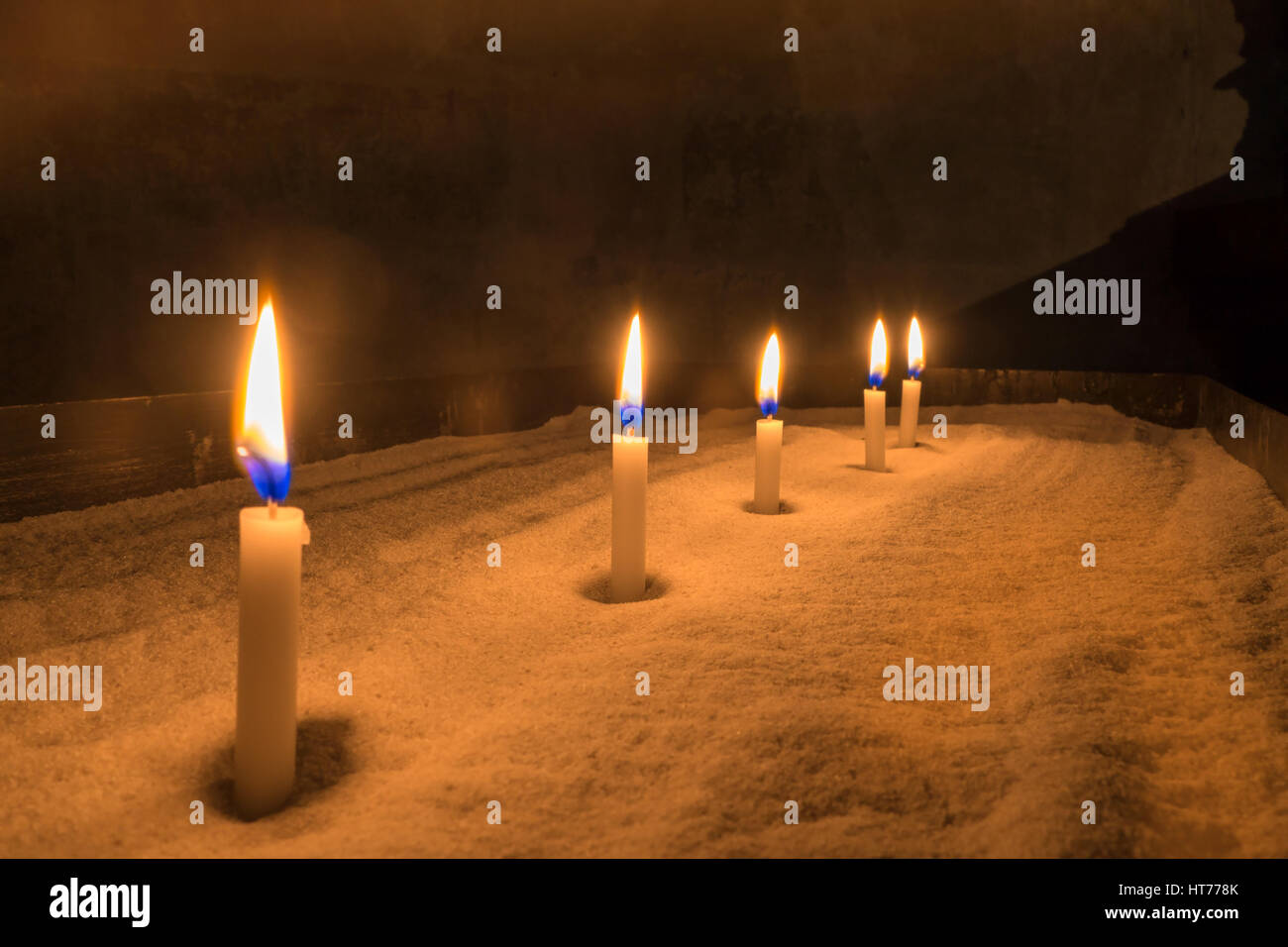 Lighted votive candles Stock Photo - Alamy