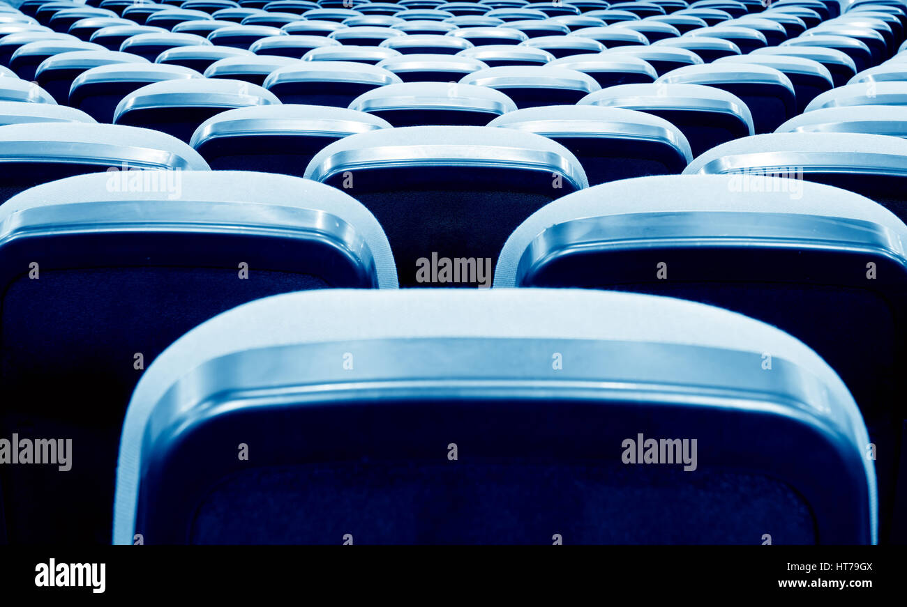 Neatly arranged cinema (theater) seating, blue tones Stock Photo - Alamy