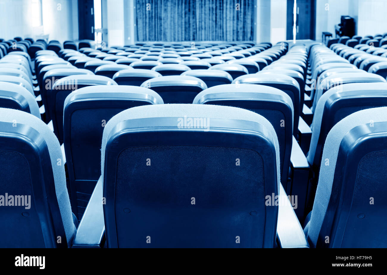 Neatly arranged cinema (theater) seating, blue tones Stock Photo - Alamy