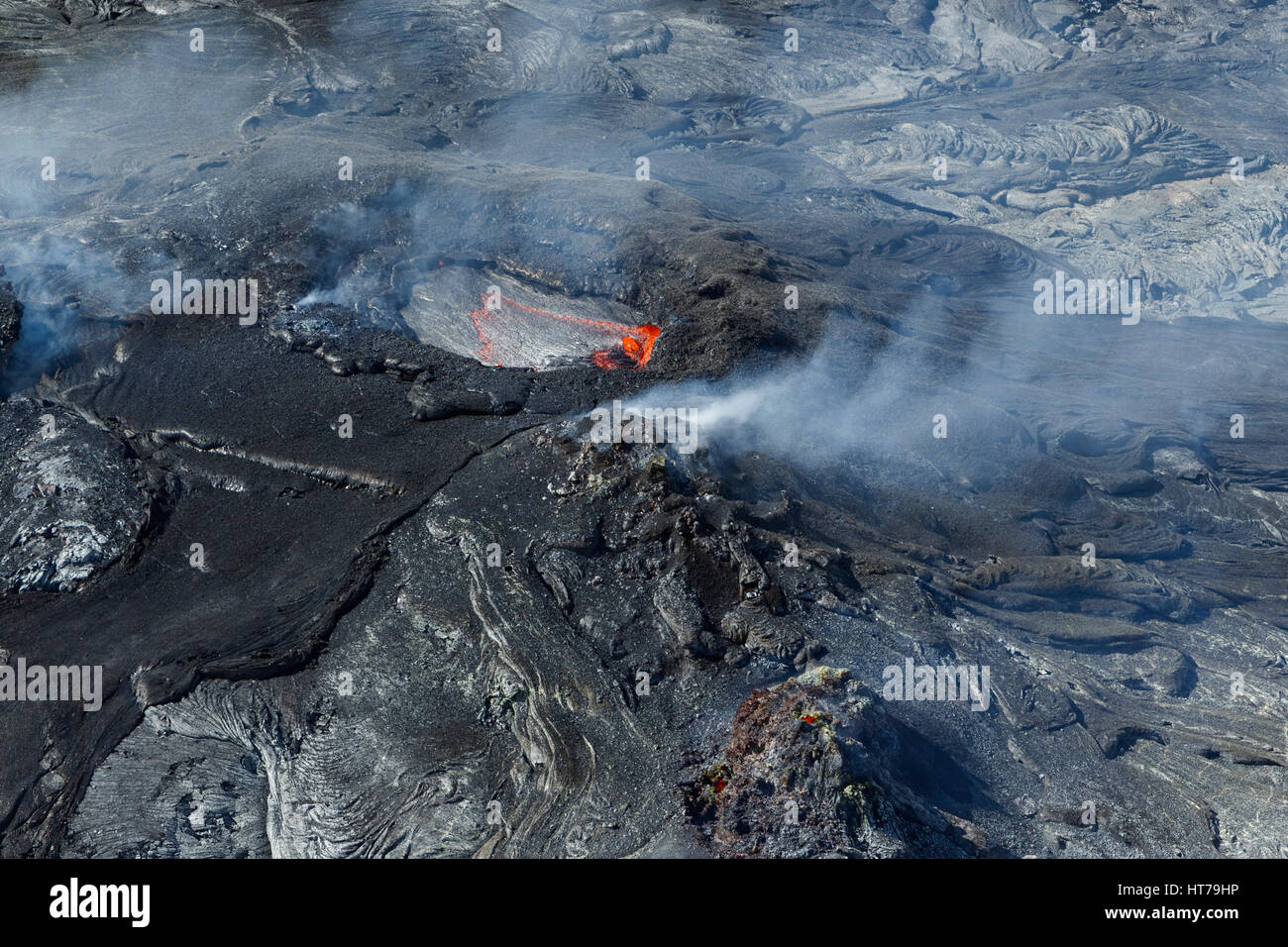Aerial view of Volcanoes NP, Puʻu ʻŌʻō, lava skylight in lava field ...