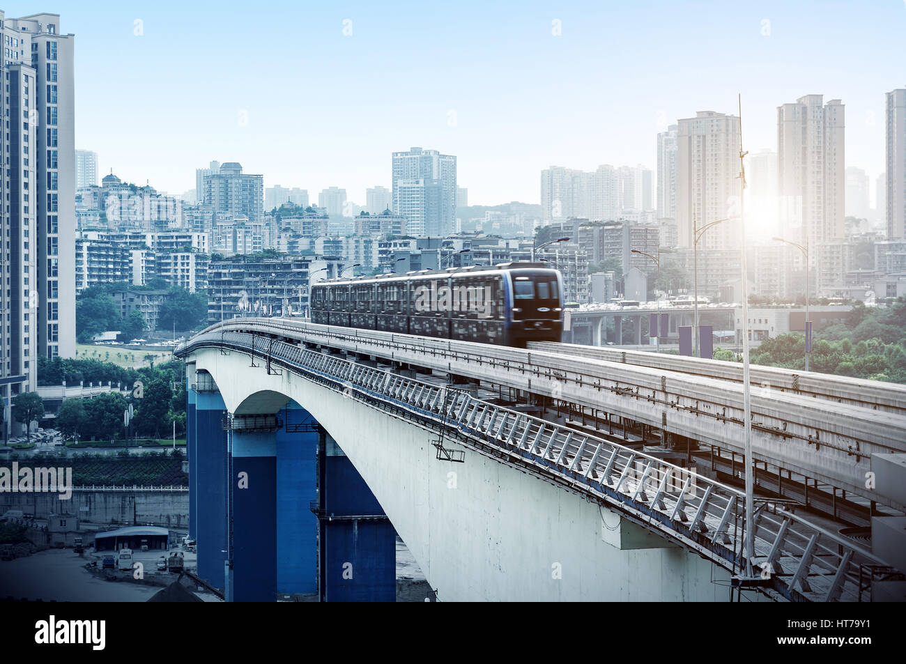 light rail moving on railway in chongqing Stock Photo - Alamy