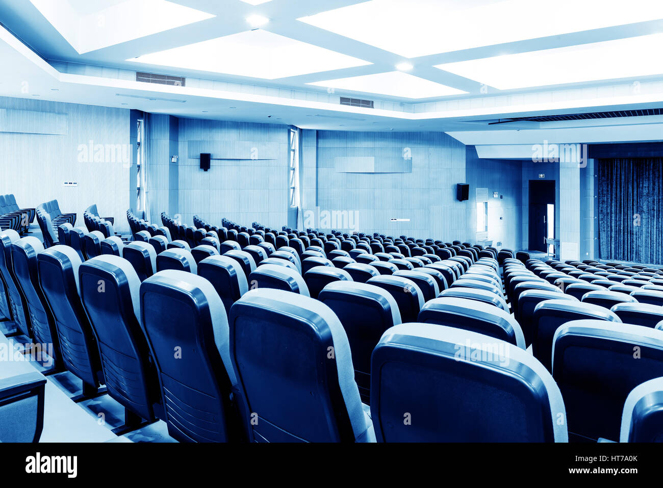 Neatly arranged cinema (theater) seating, blue tones Stock Photo - Alamy