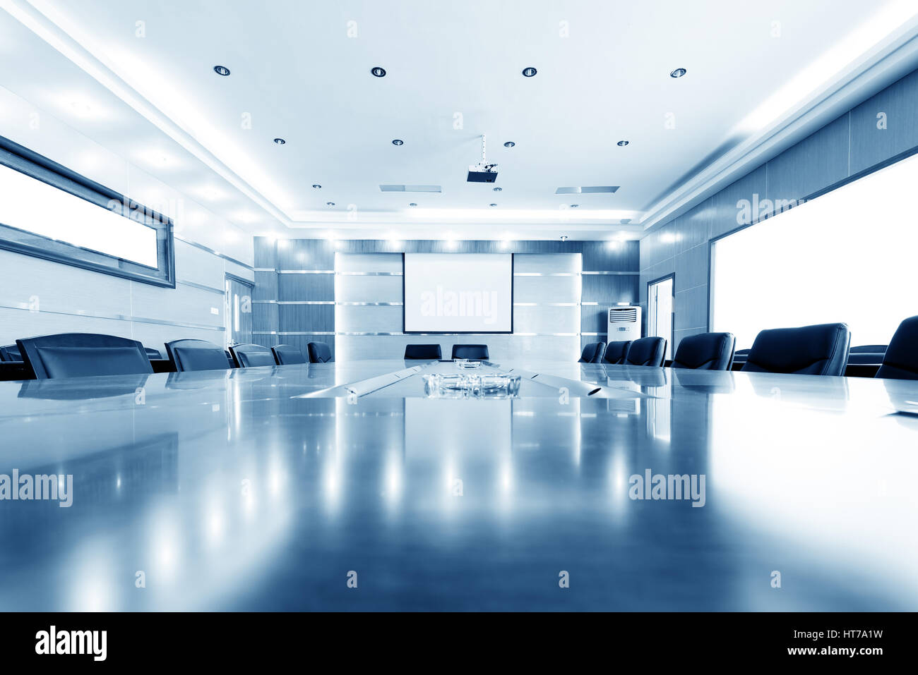 Luxurious meeting room with tables and chairs, blue tones Stock Photo ...