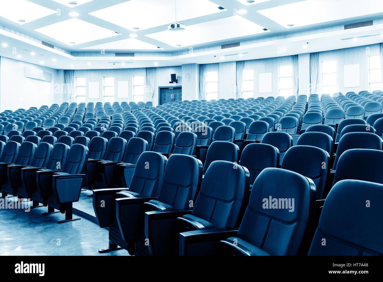 Neatly arranged cinema (theater) seating, blue tones Stock Photo - Alamy