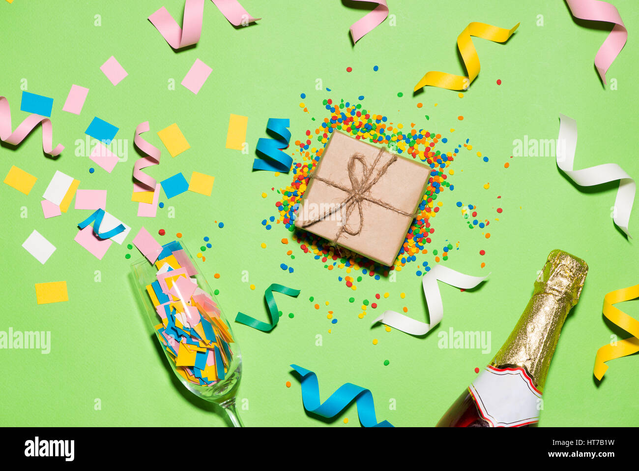 Celebration Flat lay. Gift box with colorful party items on green ...