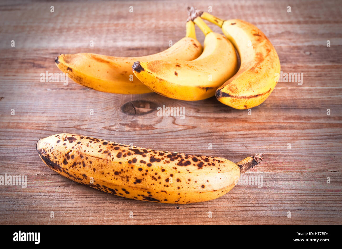 Banana on wooden table Stock Photo - Alamy