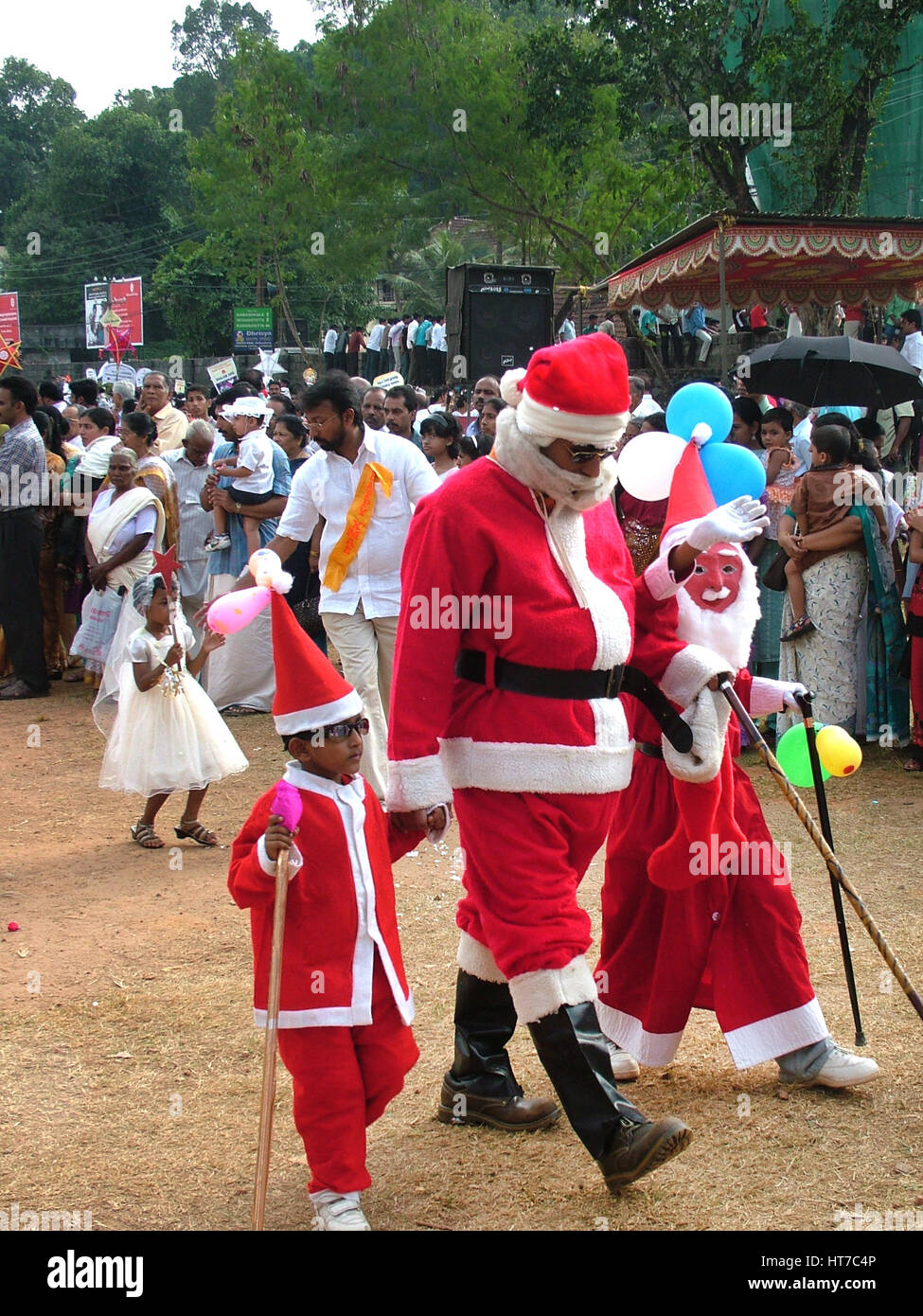 Christmas Father, Santa Claus with 2 small Santa Claus, performing ...