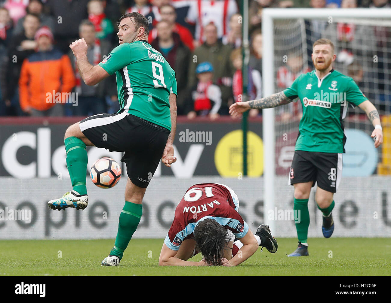 Lincoln City's Matt Rhead (left) clashes with Burnley's Joey Barton ...