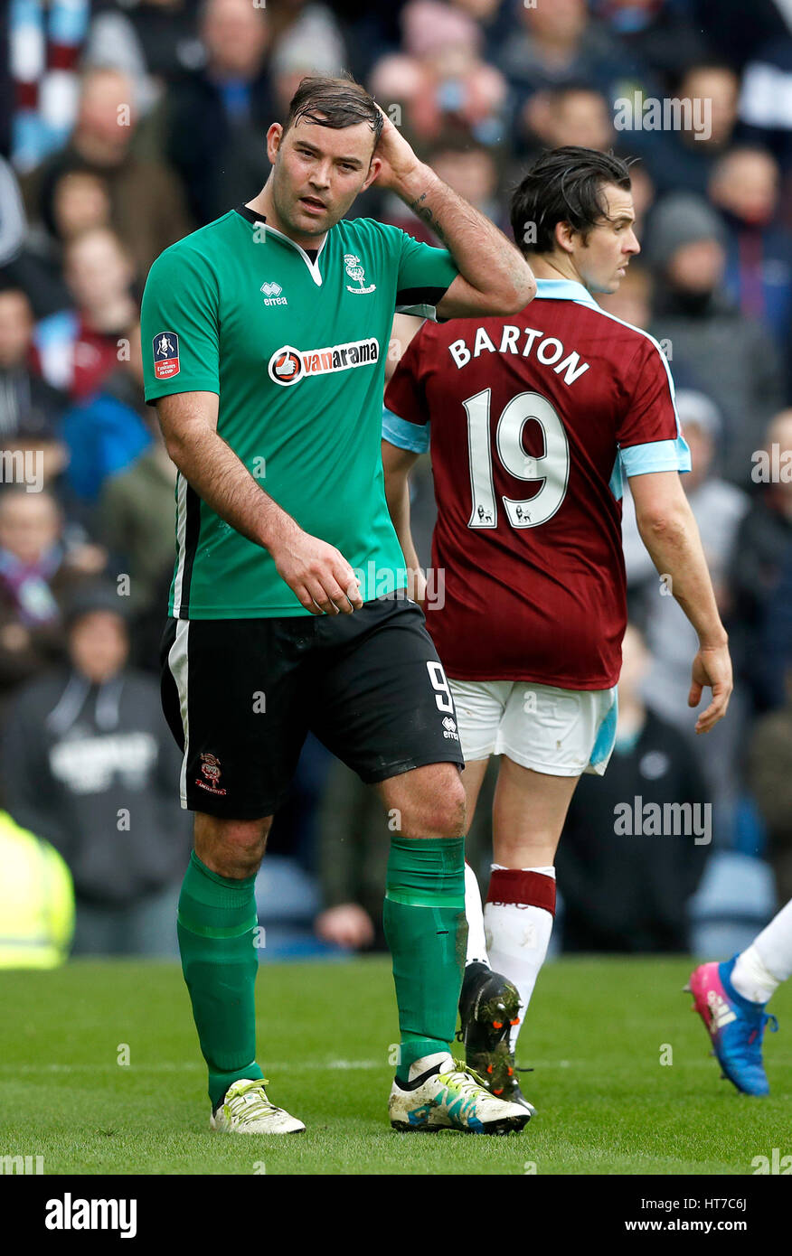 Lincoln City's Matt Rhead (left) and Burnley's Joey Barton Stock Photo ...