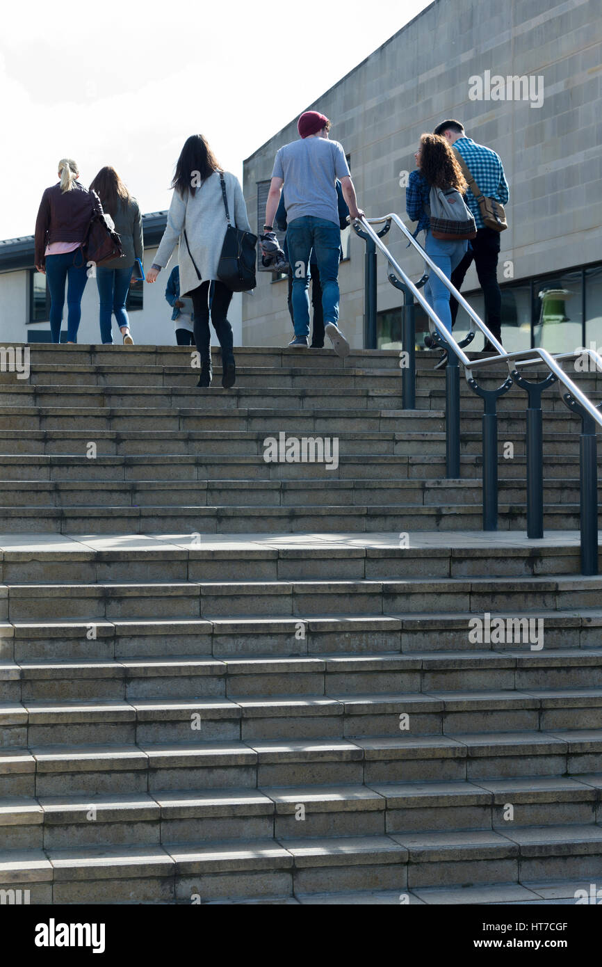 A shot of a group of students from behind walking back to their class ...