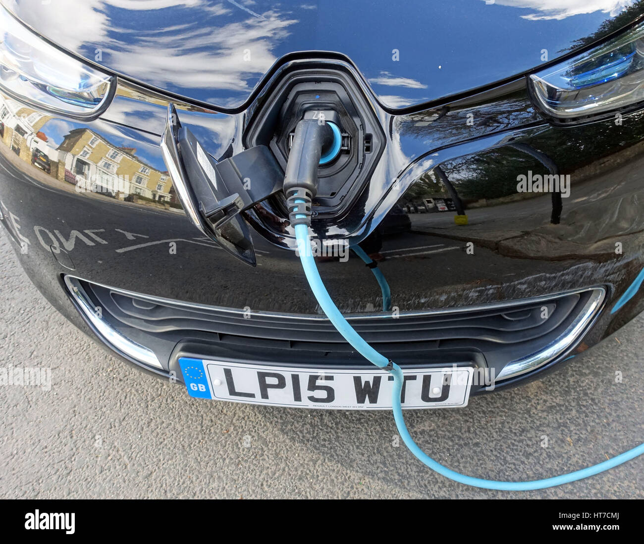 Electric car being recharged in street, London Stock Photo - Alamy