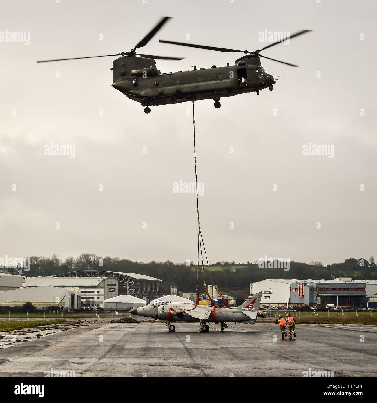 An RAF Chinook helicopter lifts a Sea Harrier 'Jump jet' across Filton ...