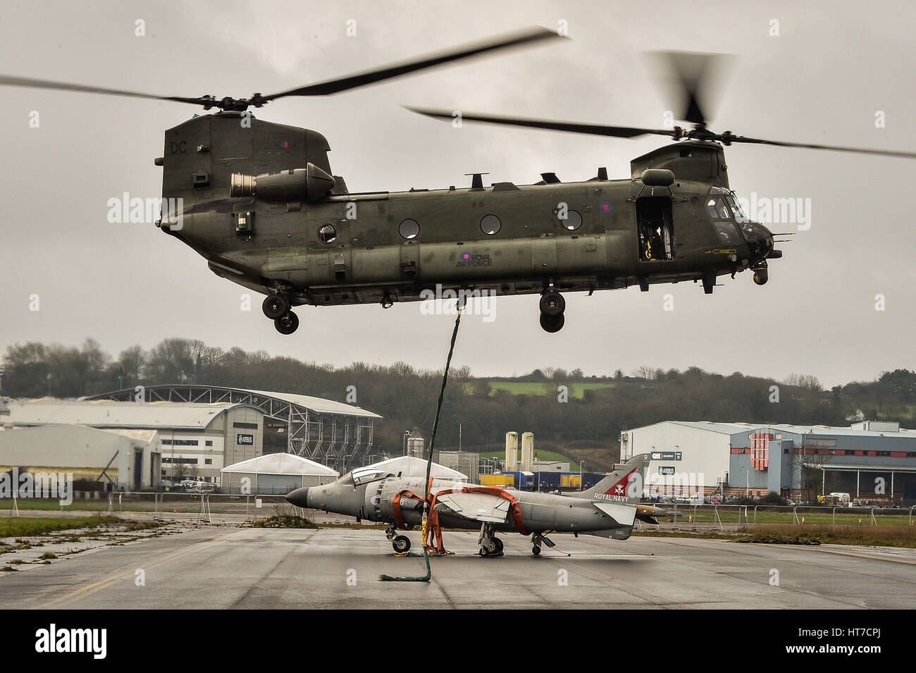 An RAF Chinook helicopter lifts a Sea Harrier 'Jump jet' across Filton ...