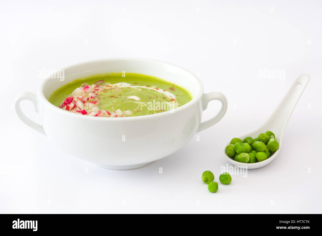 Pea cream with radishes. Isolated Stock Photo - Alamy