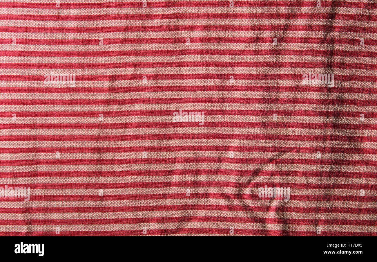 Texture of crumpled tissue in horizontal stripes. White and red stripes ...
