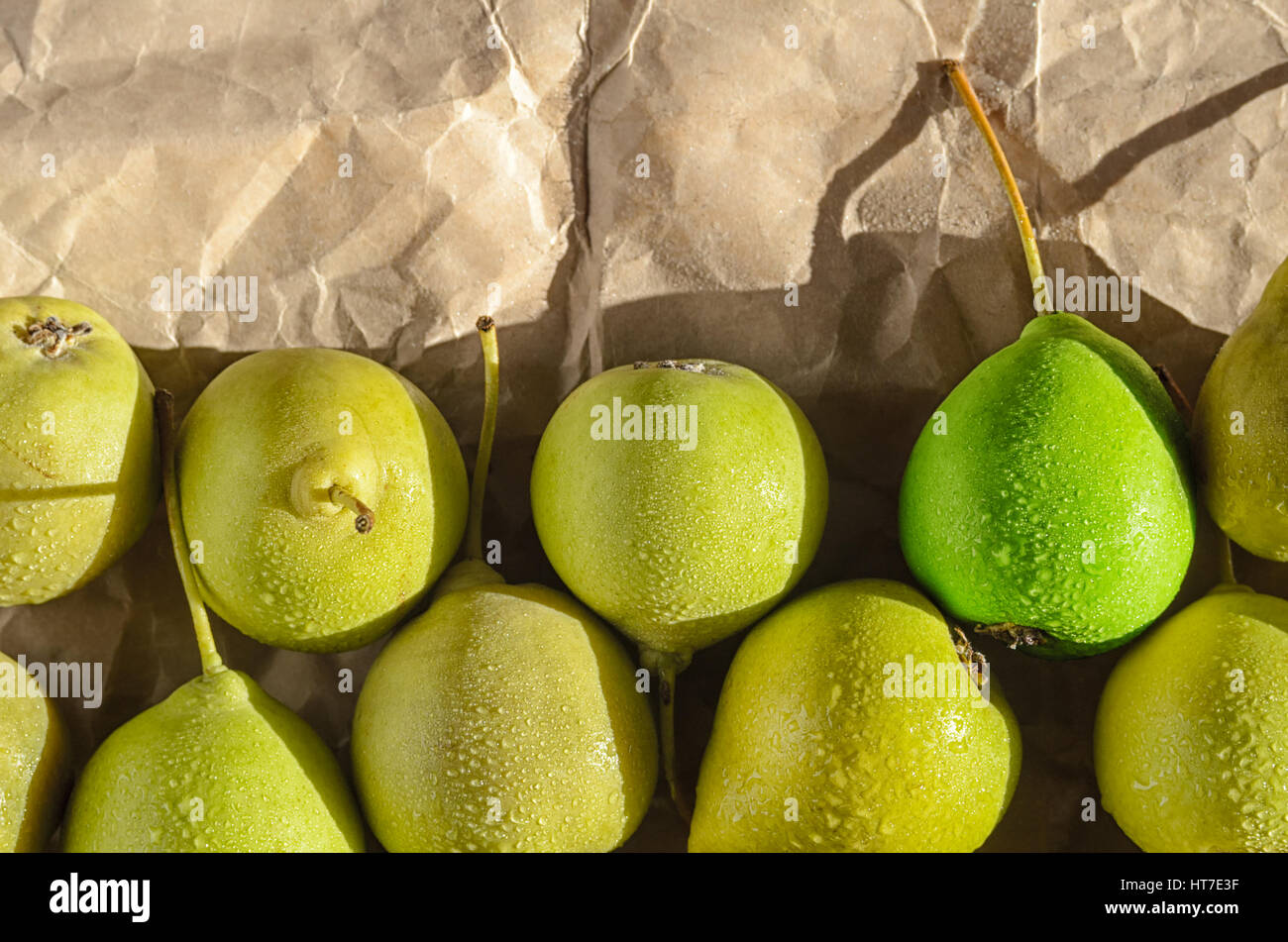 Juicy green pears with water drops background . Stand out from the ...