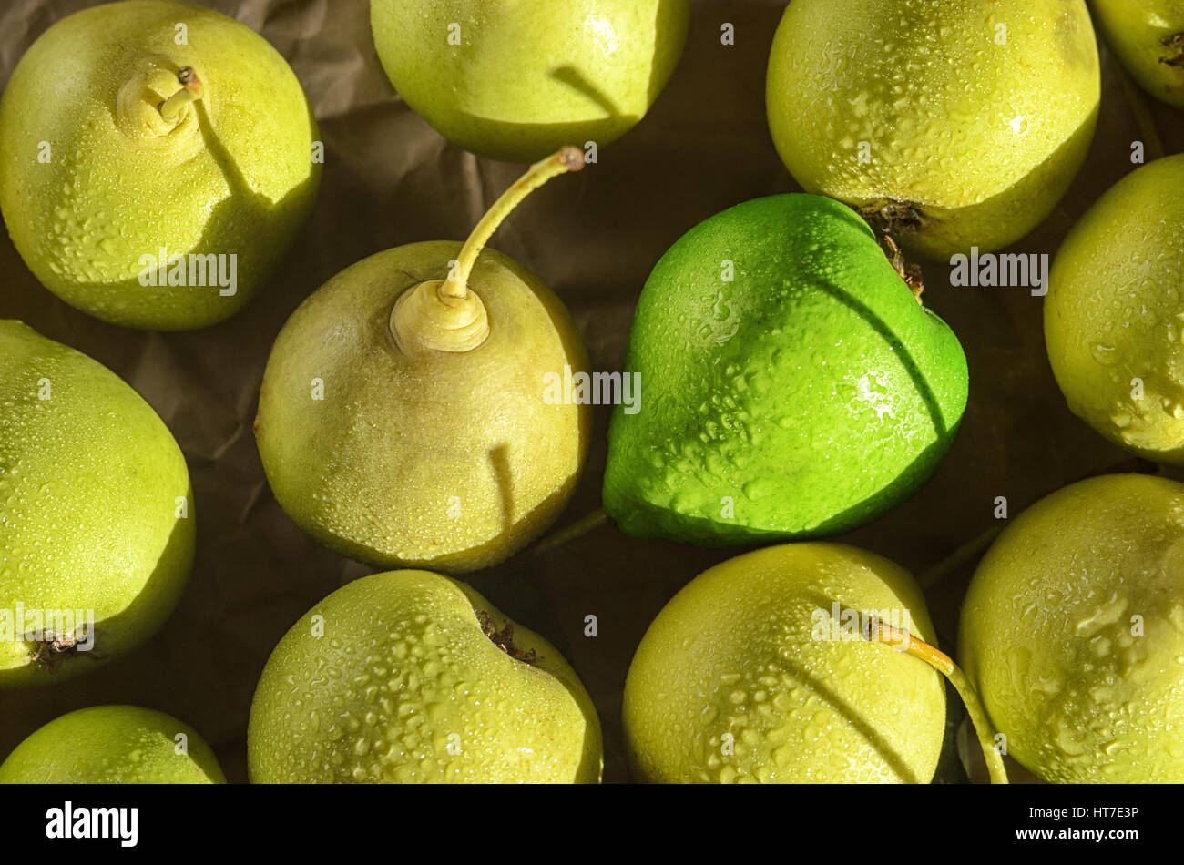 Juicy green pears with water drops background . Stand out from the ...