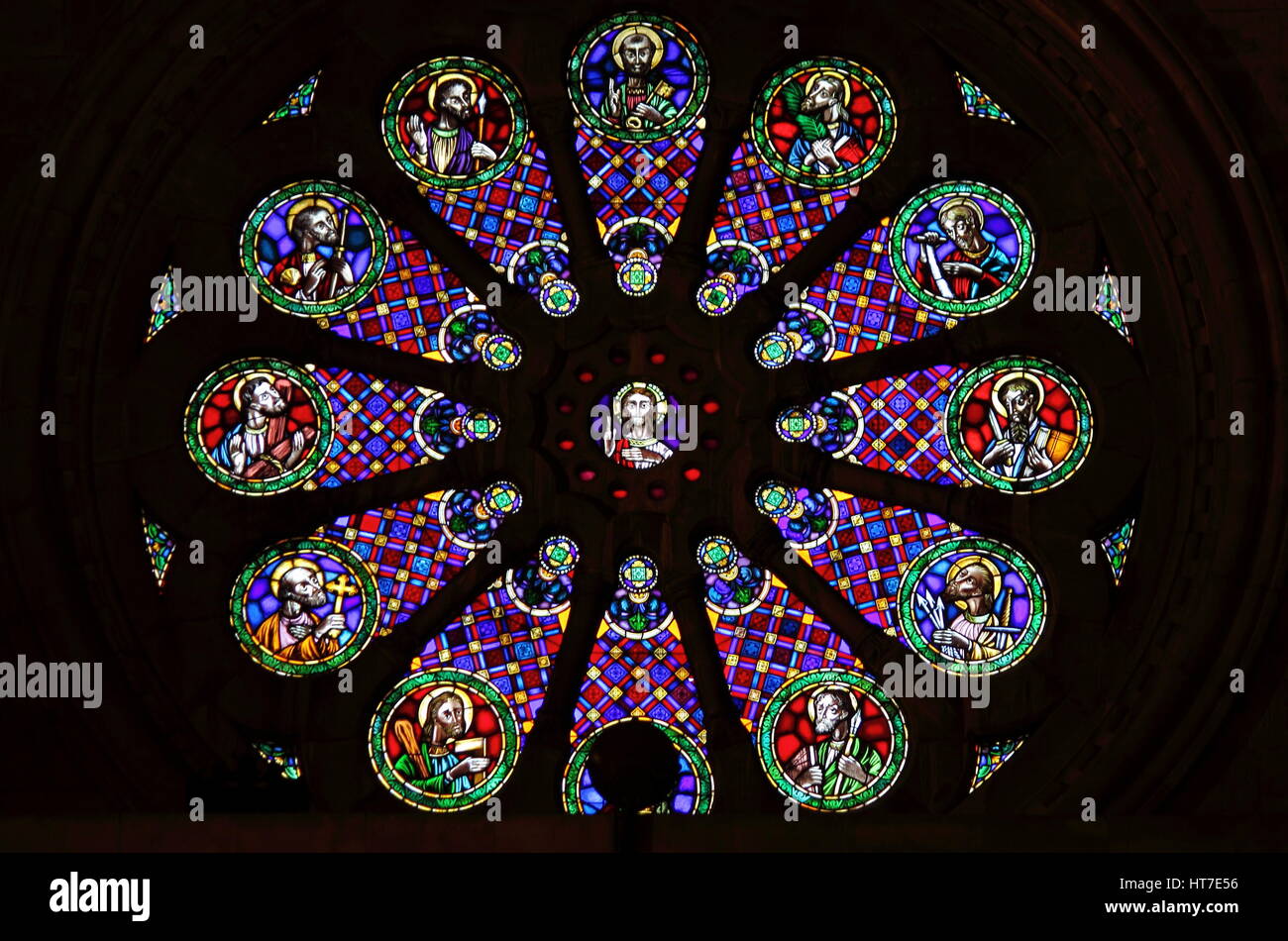 Stained glass rose window with catholic scenes Stock Photo - Alamy