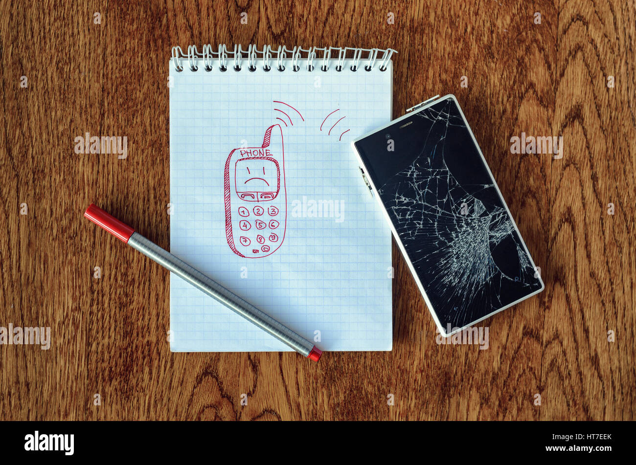 Freehand drawing of old phone in notebook. Smartphone with broken ...