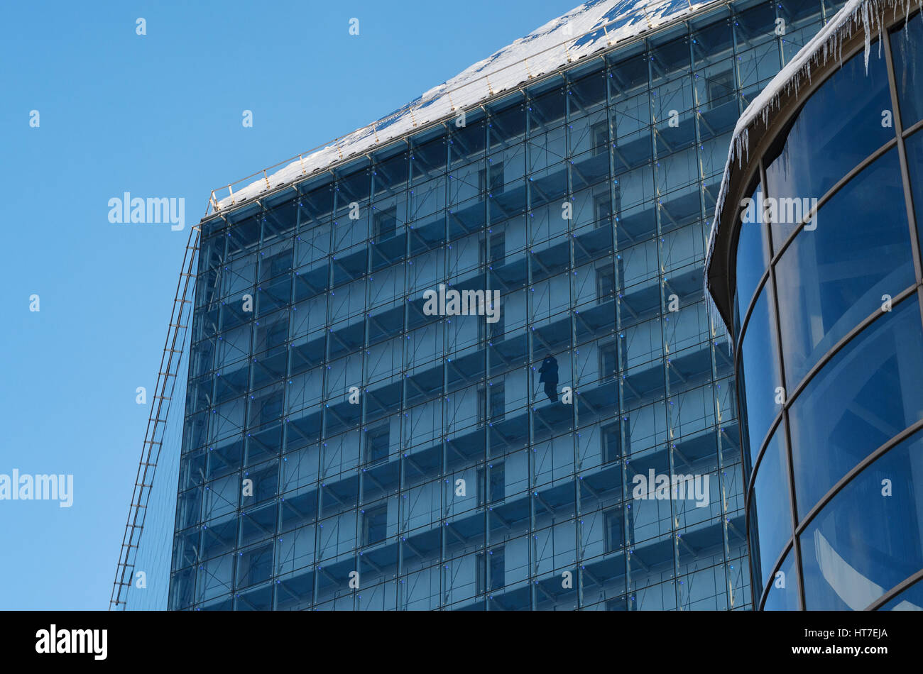 Element of modern building. The glass facade of the winter in front of ...