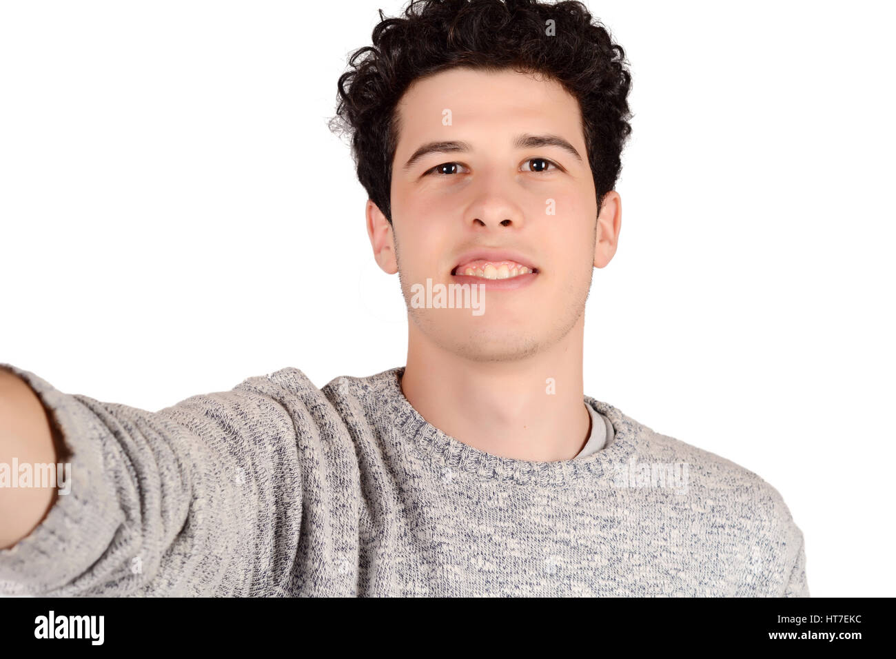 Portrait of a young handsome man taking a selfie. Isolated white ...