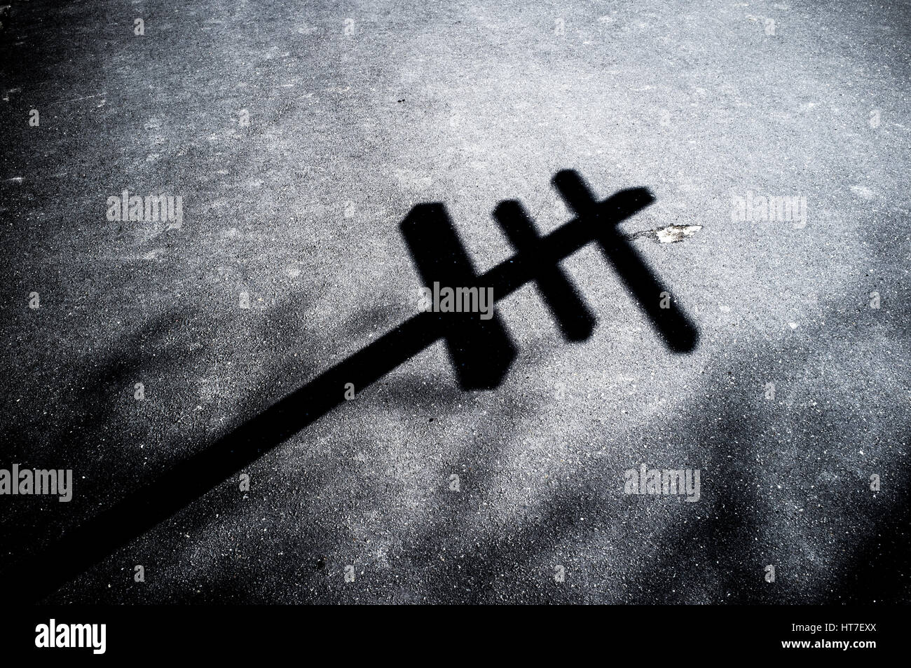 Shadow of a road sign on the ground Stock Photo - Alamy