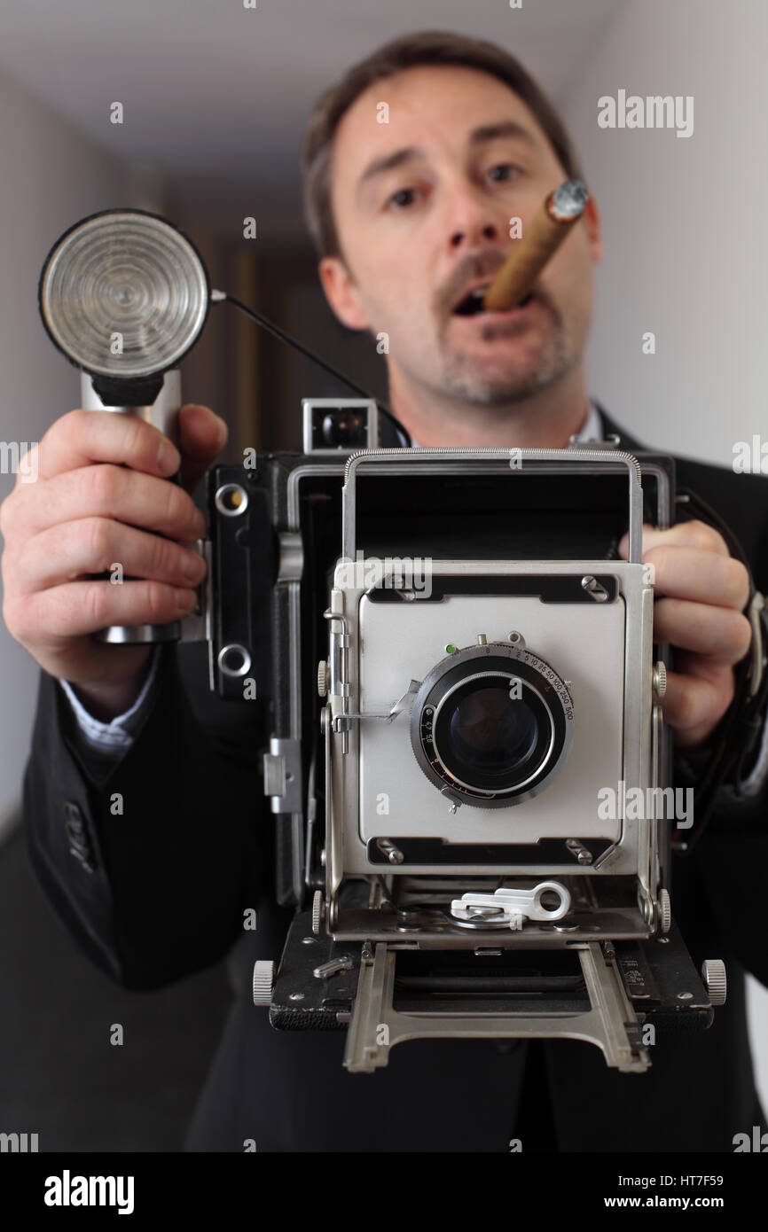 Photo of a retro 1940's style photographer taking a photo with an old ...