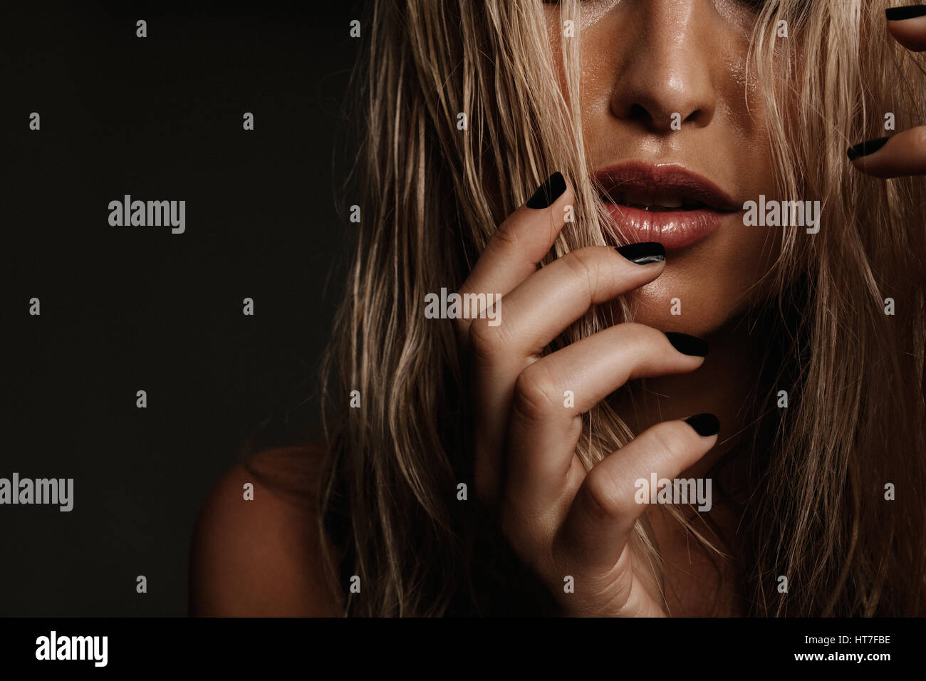 Beautiful smokey makeup woman on black background. Close up portrait ...