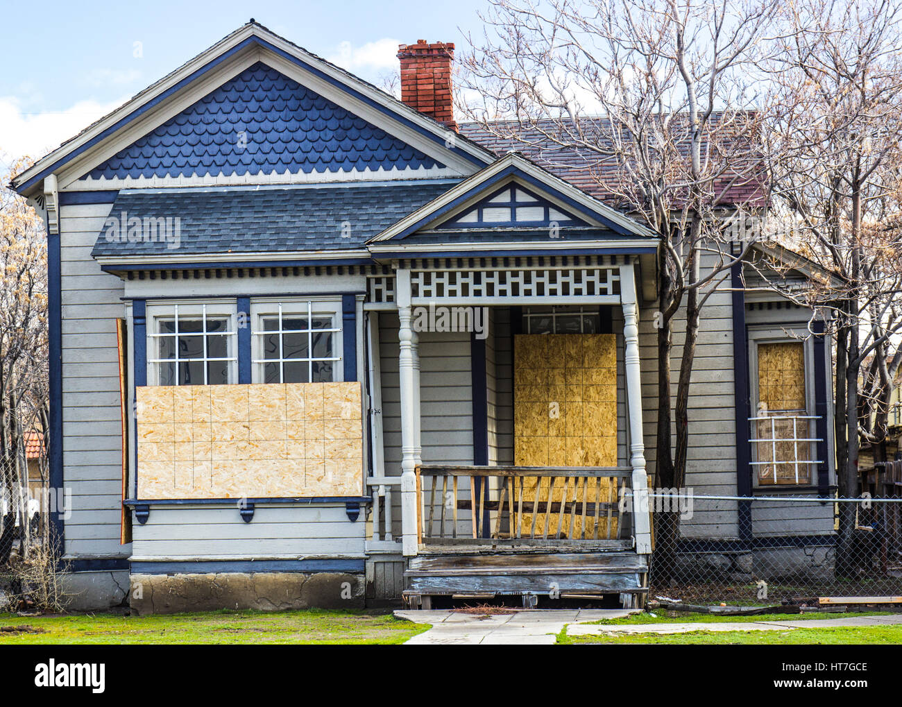 Foreclosed Home With Boarded Up Windows Stock Photo - Alamy