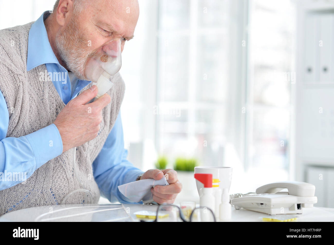 Sick elderly man makes inhalation Stock Photo - Alamy
