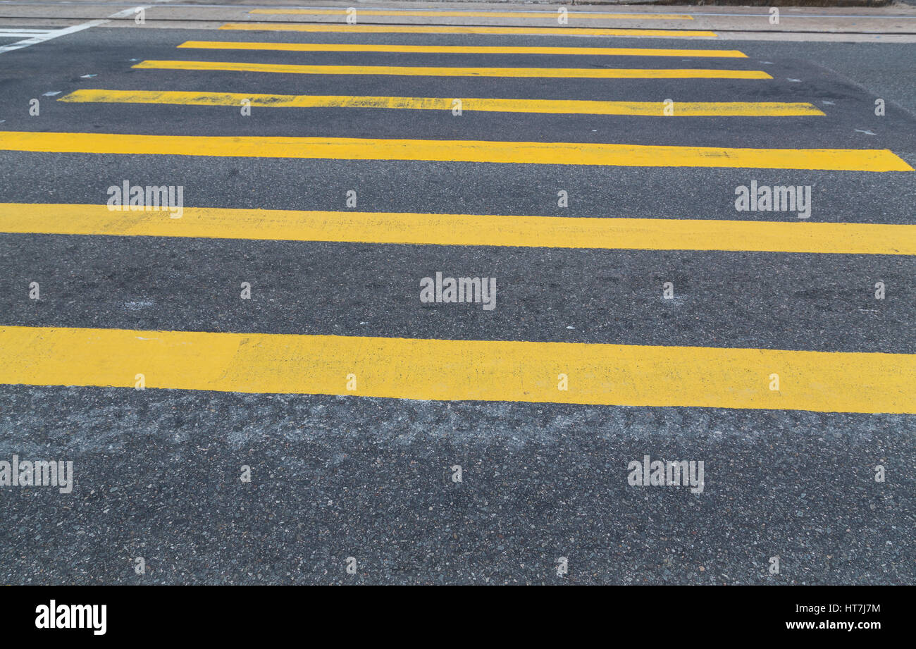 Yellow crosswalk on asphalt Stock Photo - Alamy