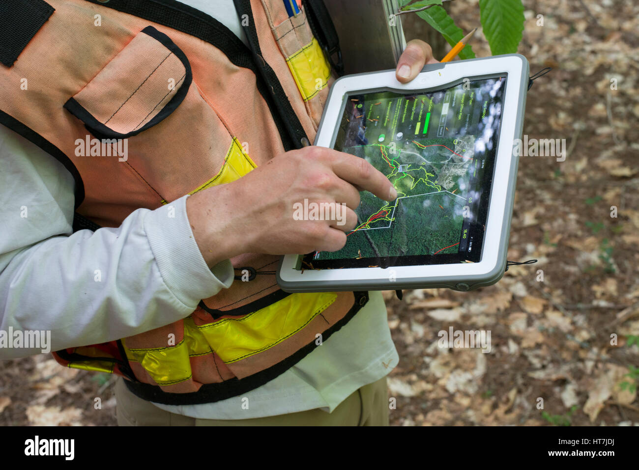 A Person Holding Ipad For Mapping And Surveying A Preserve In New ...