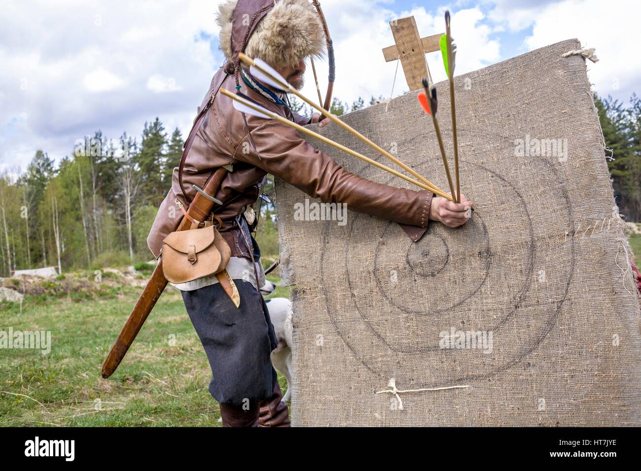 A Man Pulls Arrows From An Archery Target During A Festival Of Medieval ...