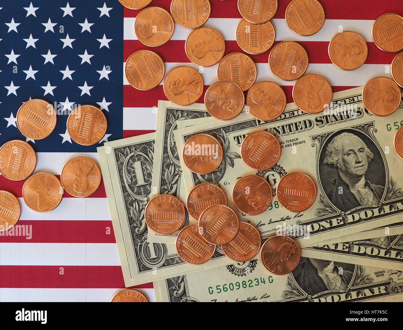 One Dollar banknotes and One Cent coins (USD) currency money over the ...