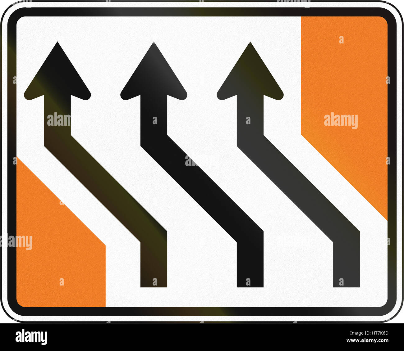 New Zealand road sign - Lanes shift to left Stock Photo - Alamy