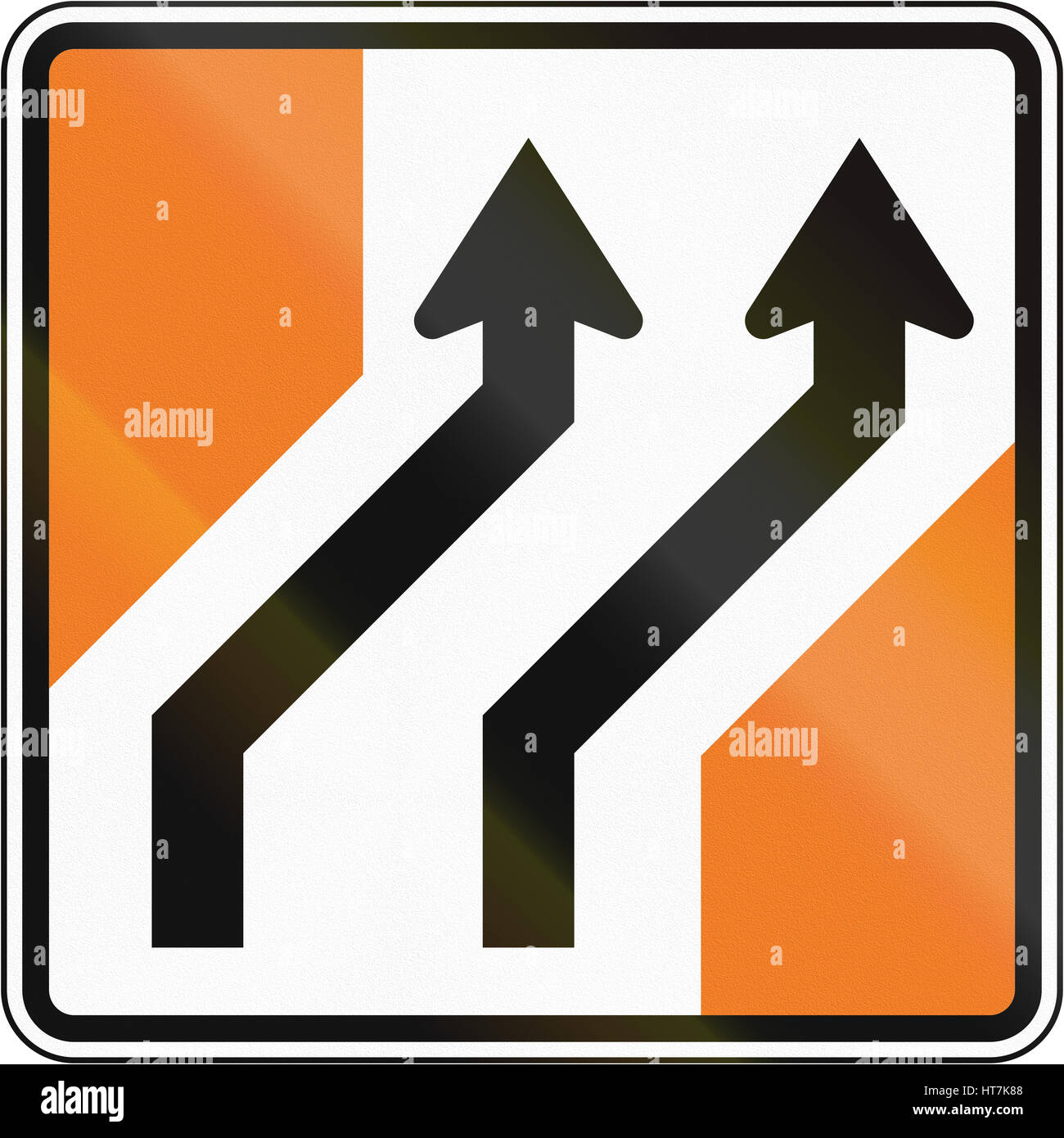 New Zealand road sign - Lanes shift to right Stock Photo - Alamy