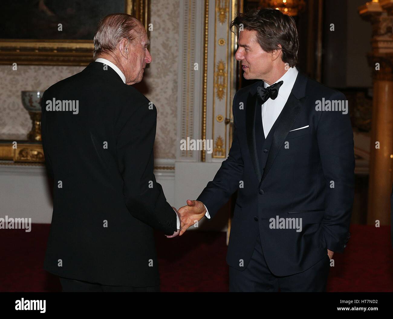 The Duke of Edinburgh shakes hands with Tom Cruise following a dinner ...