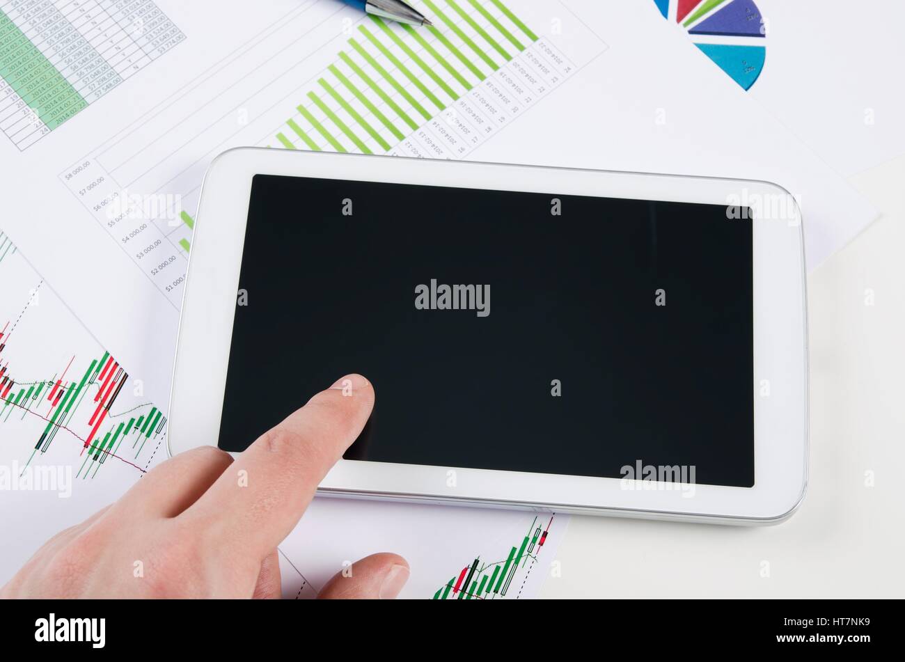 Businessman working with digital tablet. Report charts on desk Stock ...