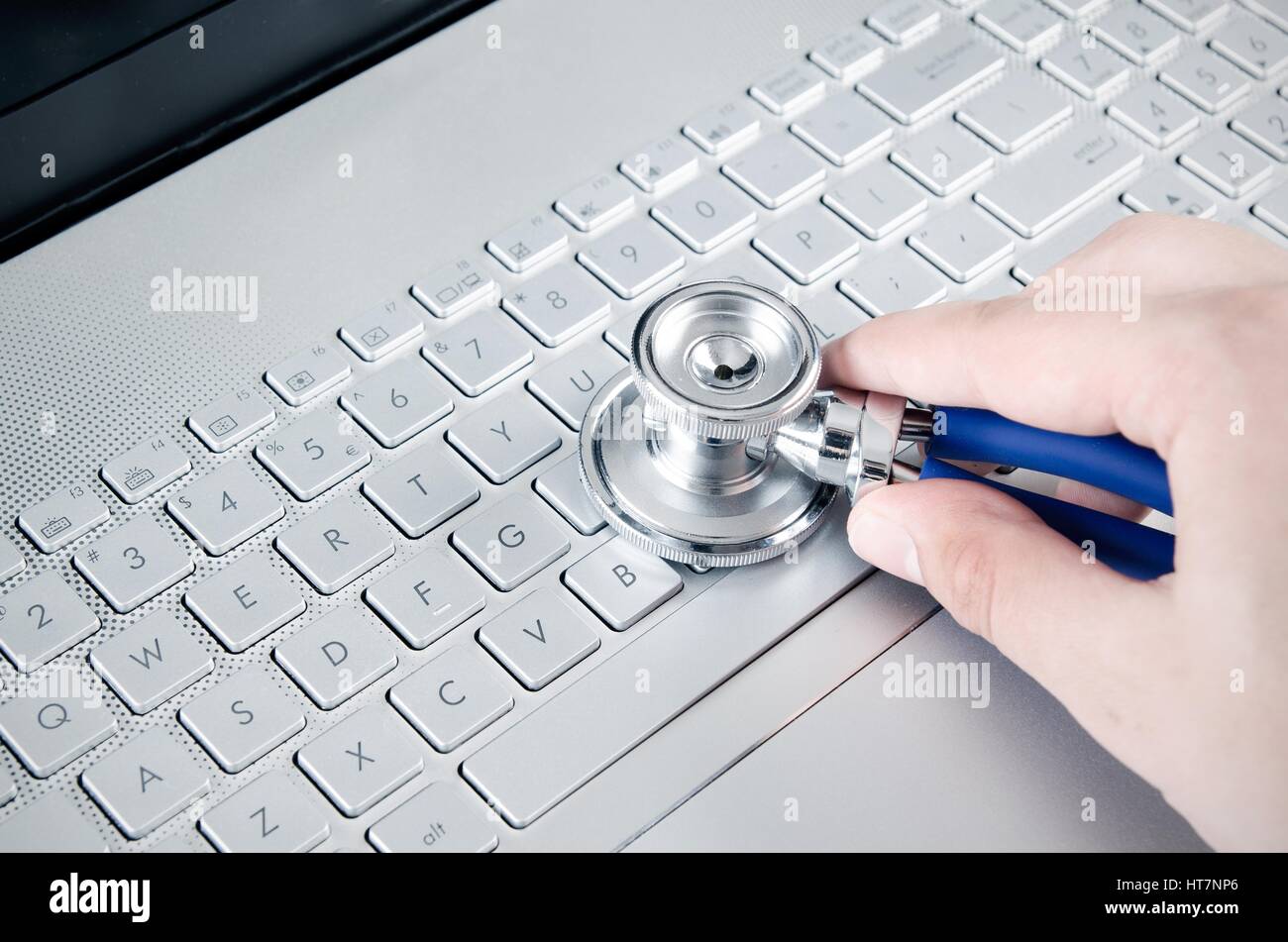 Diagnosis and repair of computers. Stethoscope on laptop Stock Photo ...