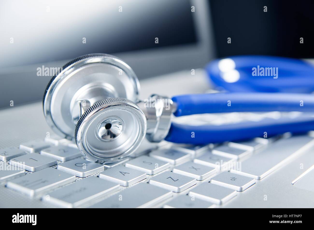 Diagnosis and repair of computers. Stethoscope on laptop Stock Photo ...