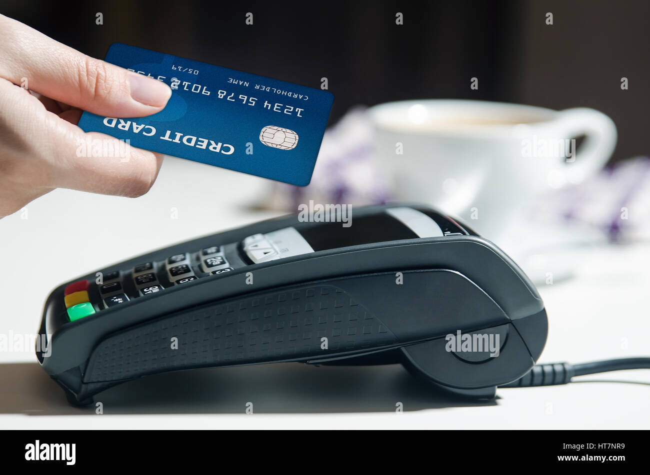 Woman hand using payment terminal in restaurant Stock Photo - Alamy