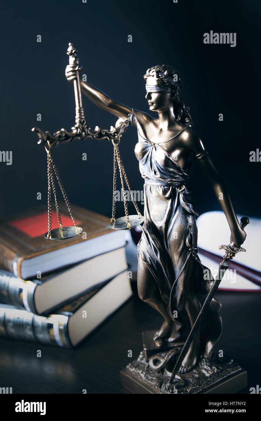 Law concept with Themis and books in background. Composition in court ...