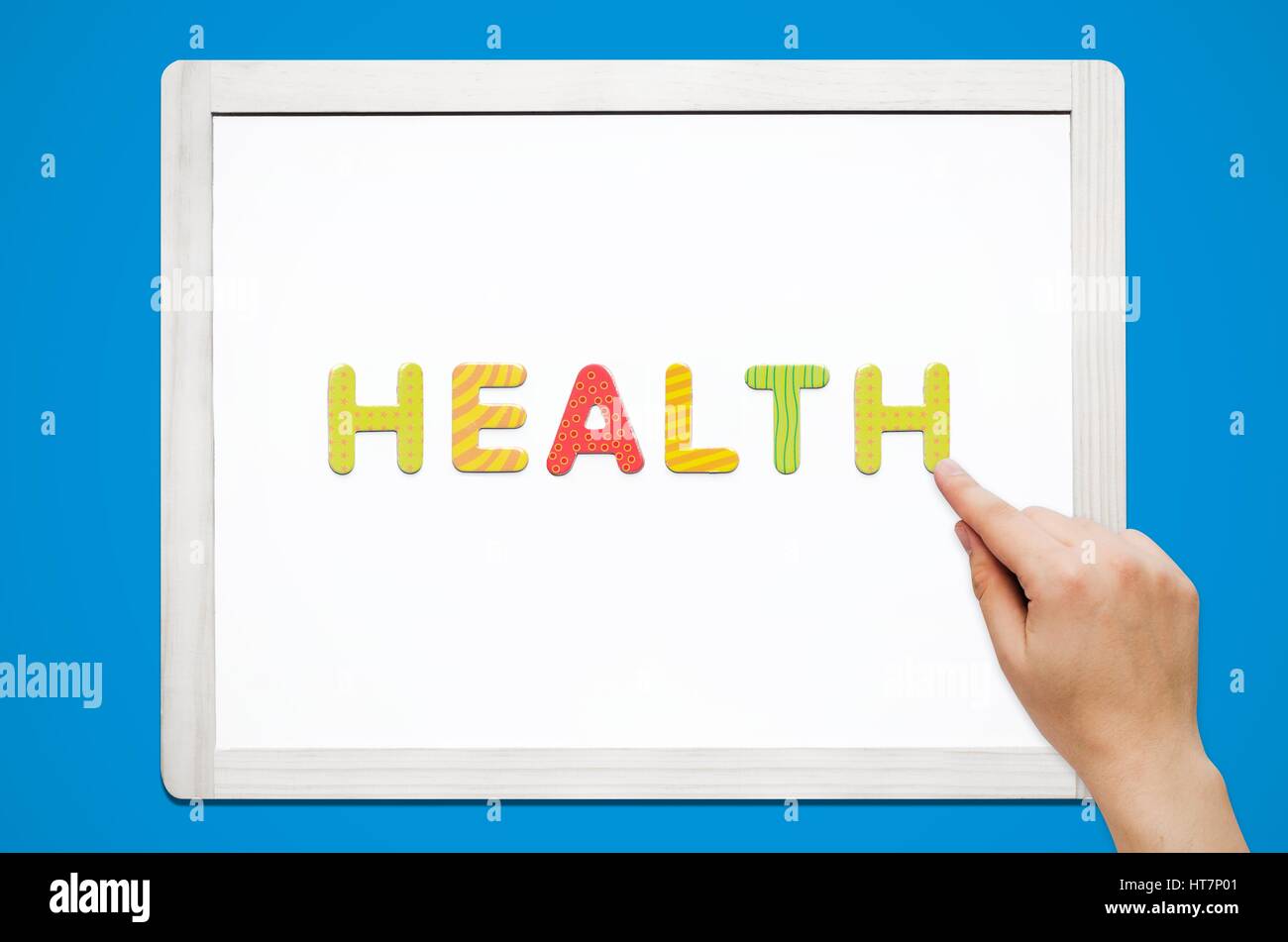 Hands put the word Health with magnetic letters. Colorful alphabet kit ...