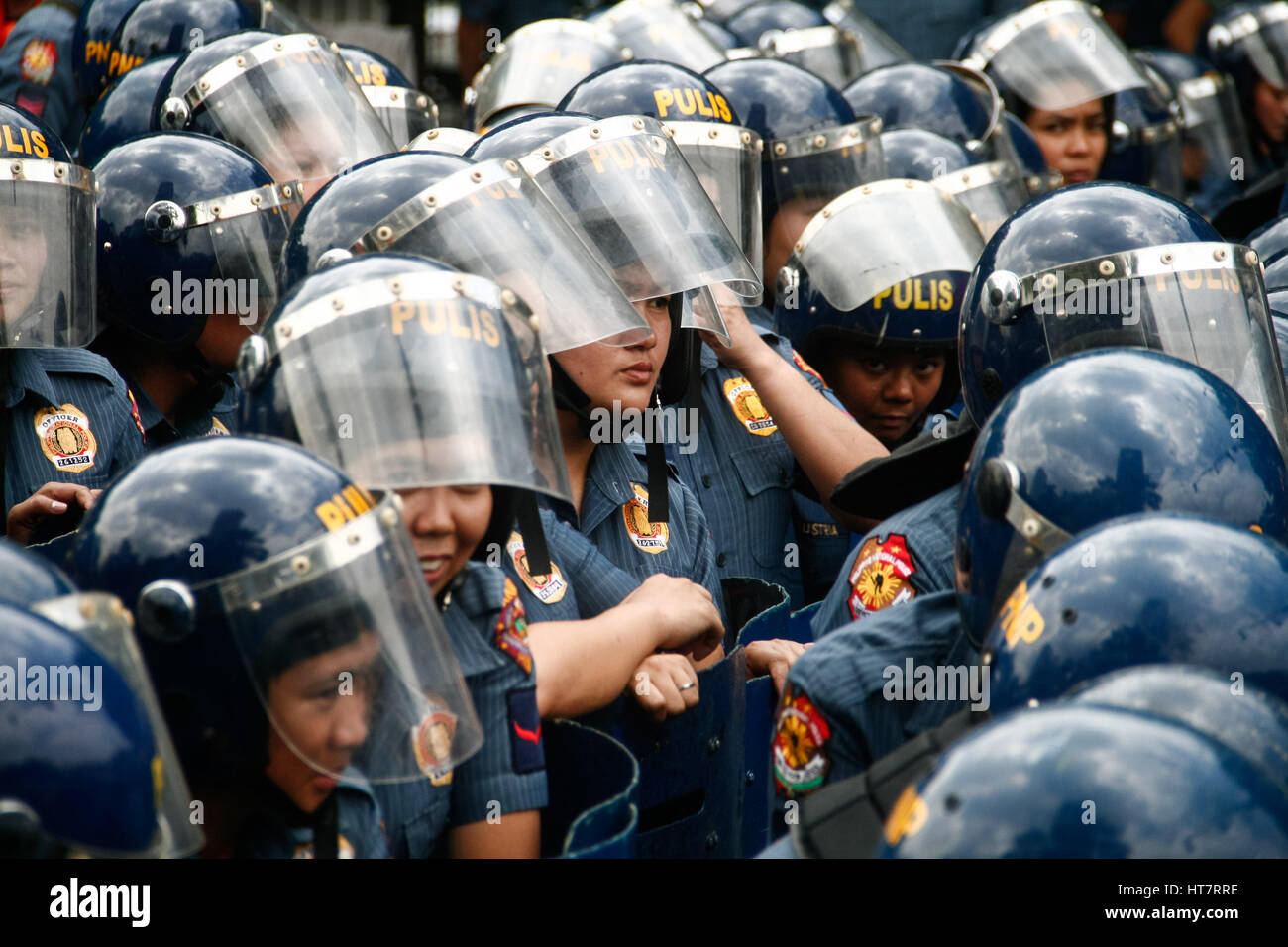 Philippines. 8th Mar, 2017. A platoon of women police officers with ...