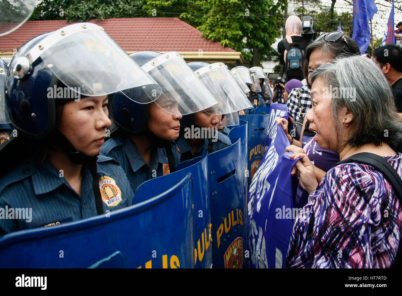 Philippines. 8th Mar, 2017. A platoon of women police officers with ...