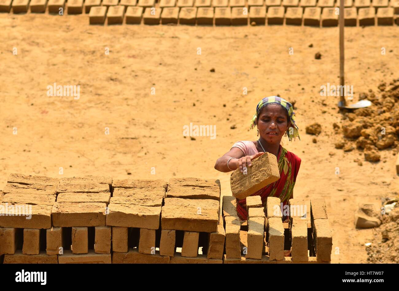 Dimapur, India. 08th Mar, 2017. An Indian woman labour works at a ...