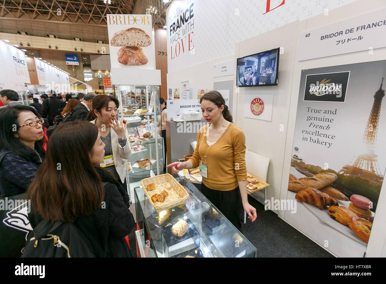 An exhibitor shows her products at the France booth during the 42nd ...