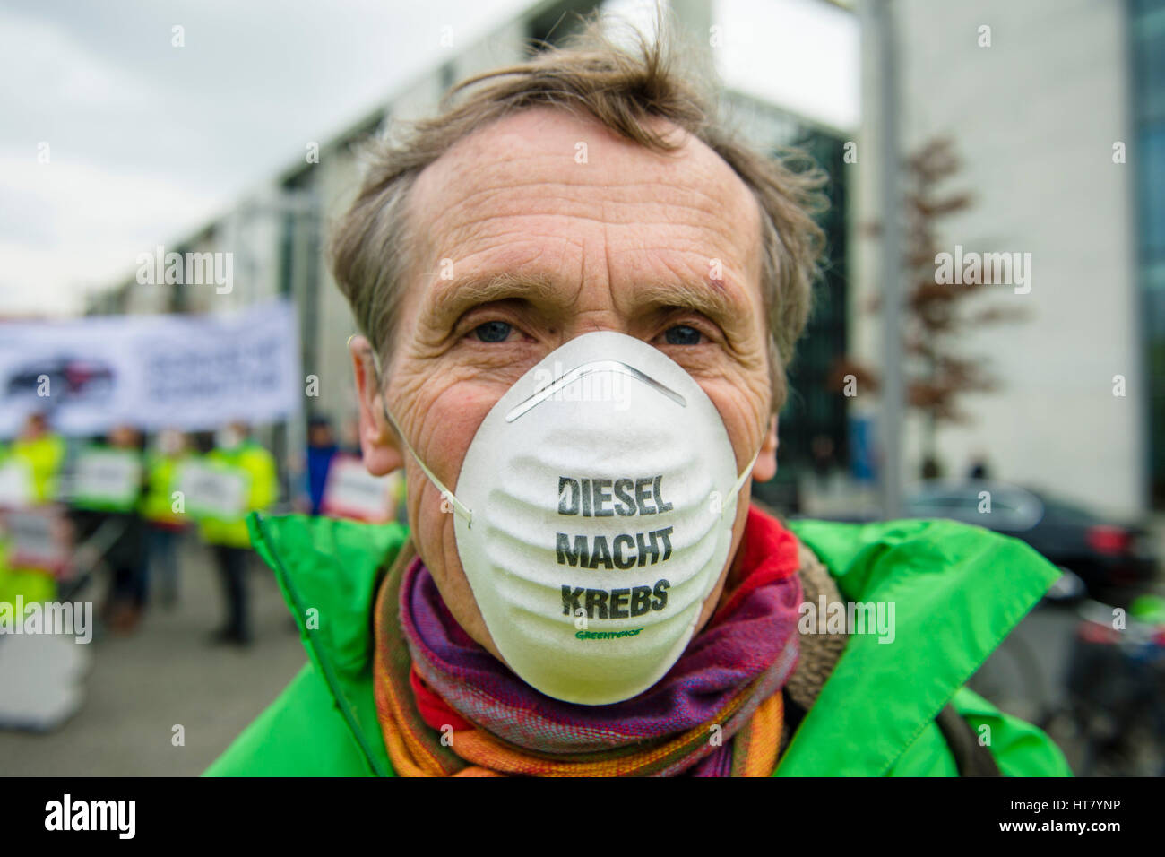 Berlin, Germany. 08th Mar, 2017. A Greenpeace activist wears a face ...